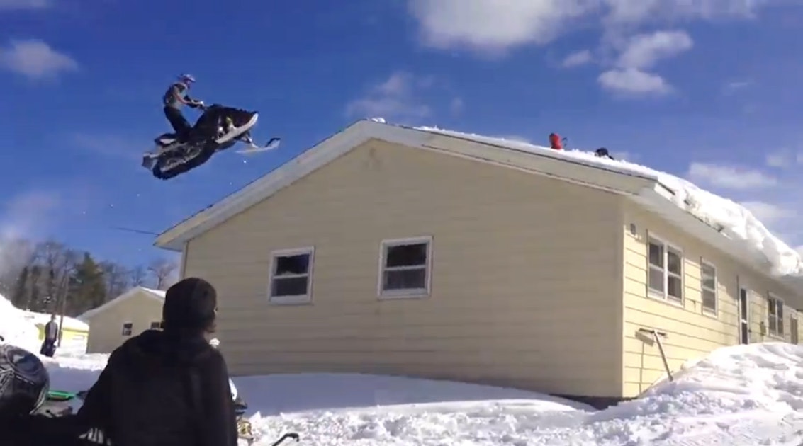 Snowmobiling in the Upper Peninsula … over a house